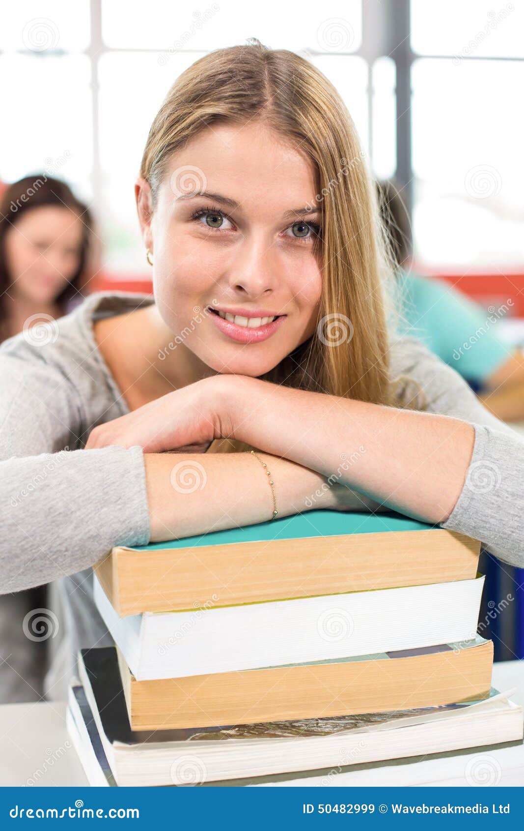 Smiling Female Student in Classroom Stock Image - Image of looking ...