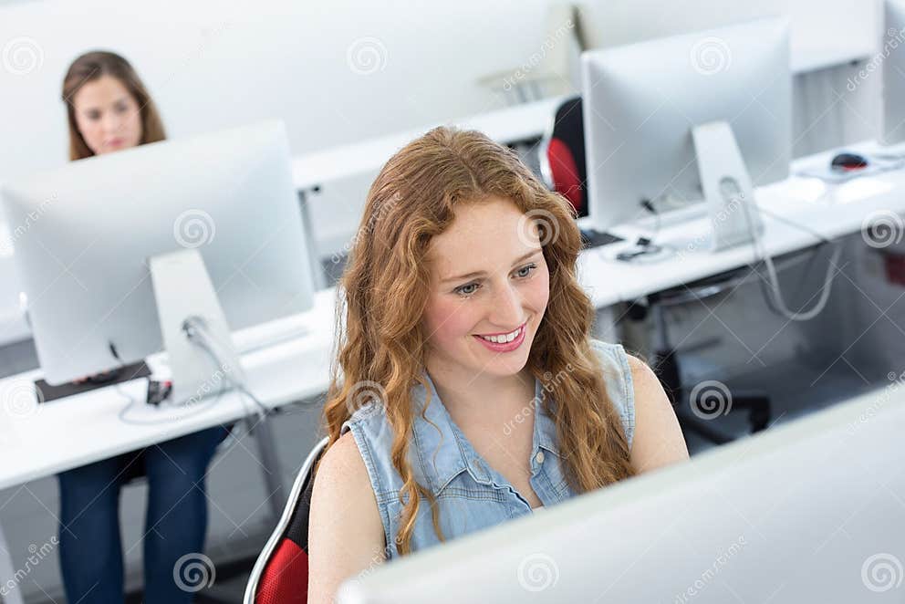 Smiling Female Student in Computer Class Stock Photo - Image of happy ...