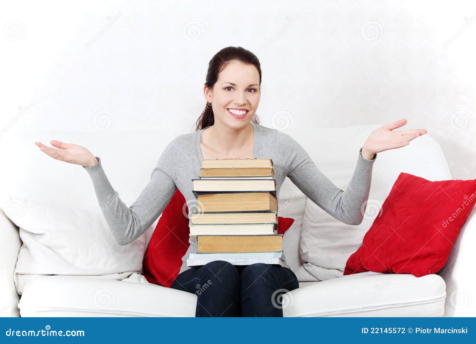 Smiling Female Student Holding a Pile of Books. Stock Photo - Image of ...