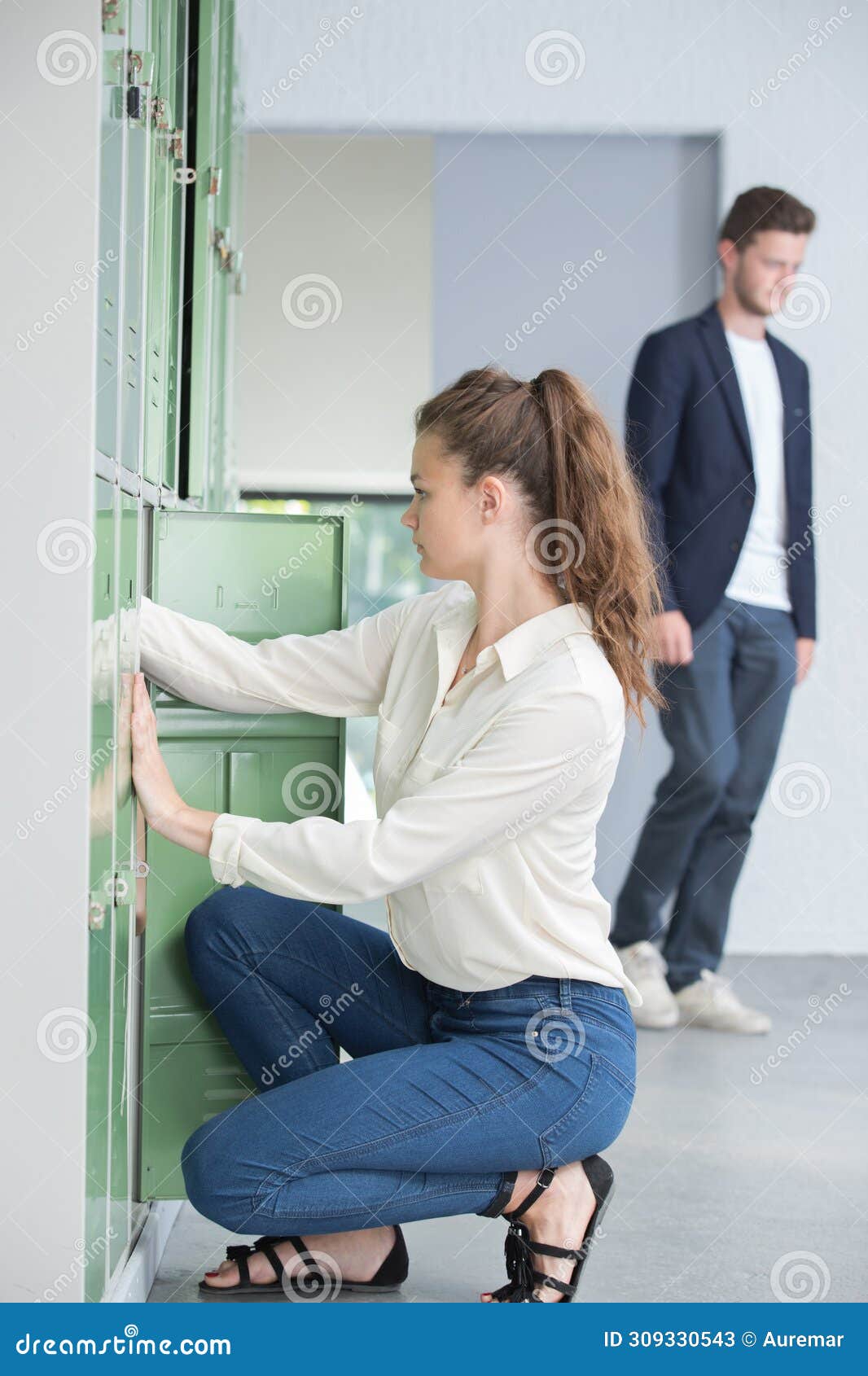 Smiling Female Student Opening Locker at University Stock Image - Image ...
