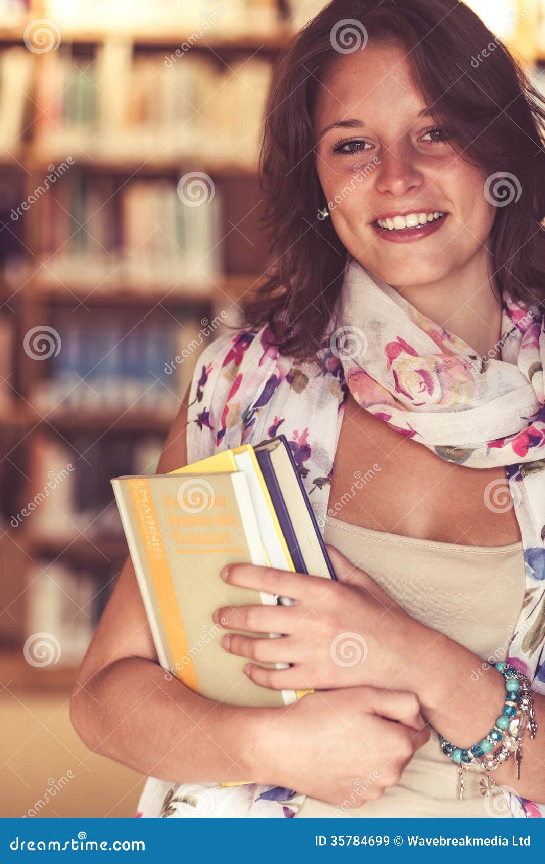 Smiling Female Student Standing in the Library Stock Image - Image of ...