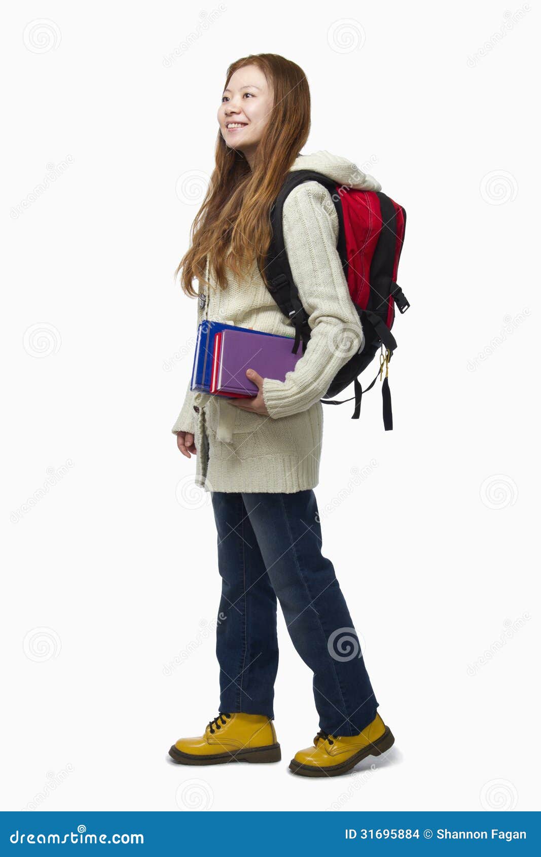 Smiling Female Student Walking Stock Photo - Image of learning, beige ...