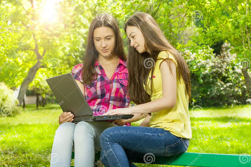 Smiling Female Students Using Laptop Stock Image - Image of charming ...
