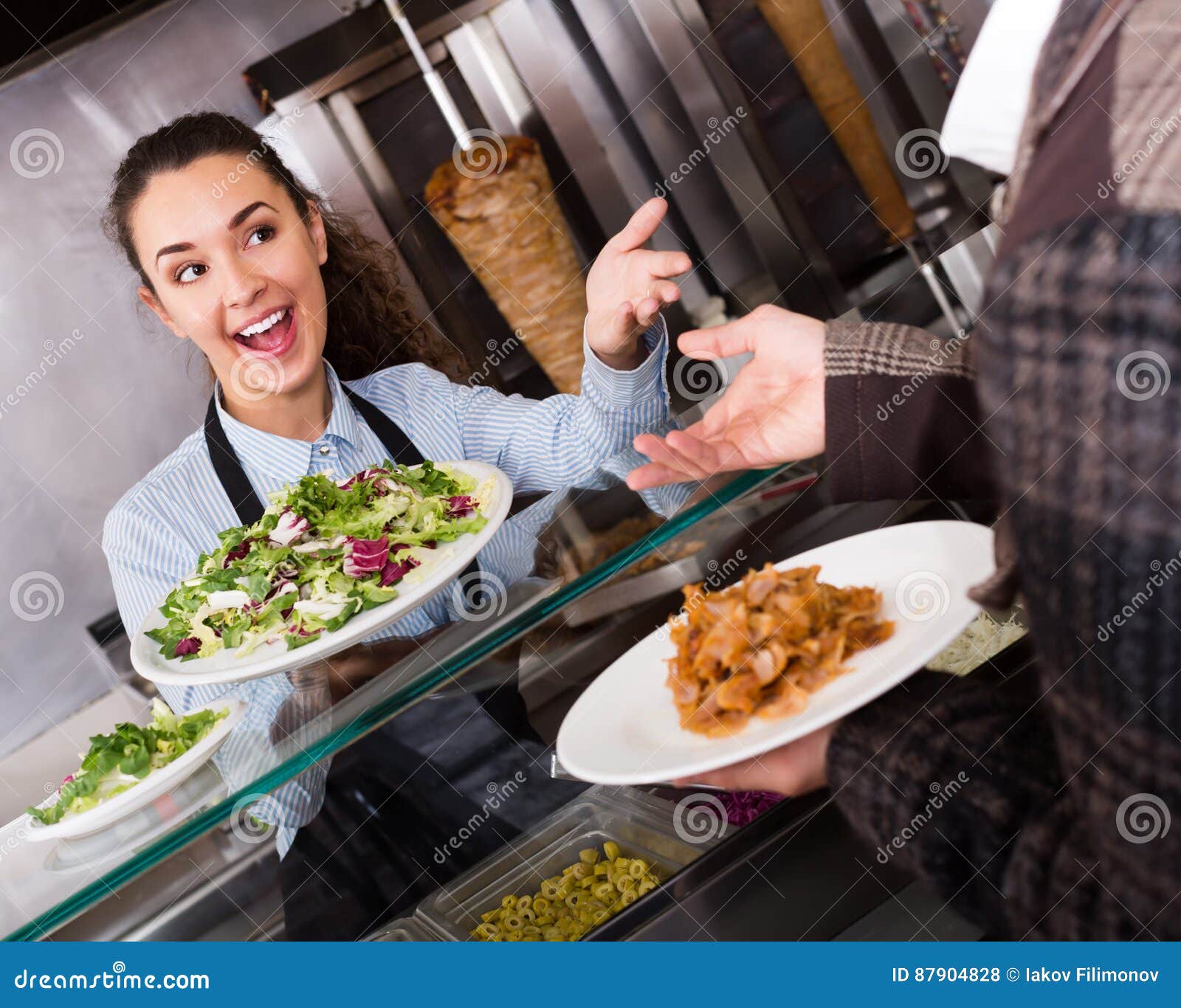 Smiling Female Worker Serving Customer Stock Photo - Image of arab ...