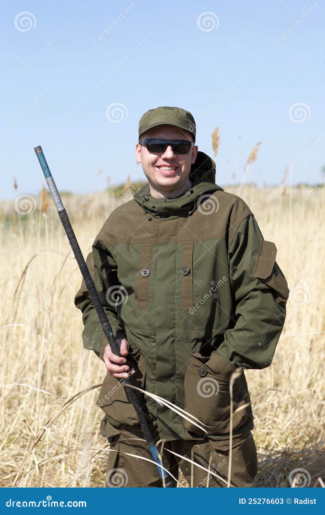 Smiling fisherman on field stock image. Image of equipment - 25276603
