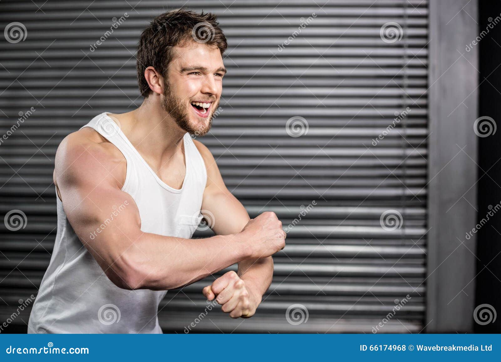 Smiling fit man screaming stock photo. Image of body - 66174968