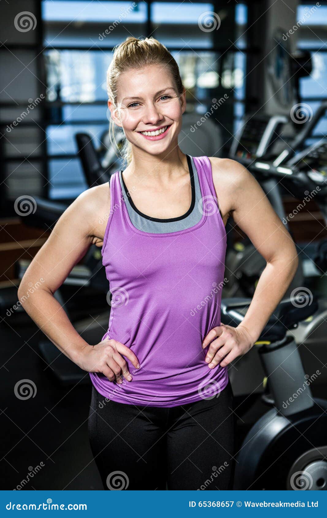 Smiling Fit Woman with Hands on Hips Stock Image - Image of athlete ...