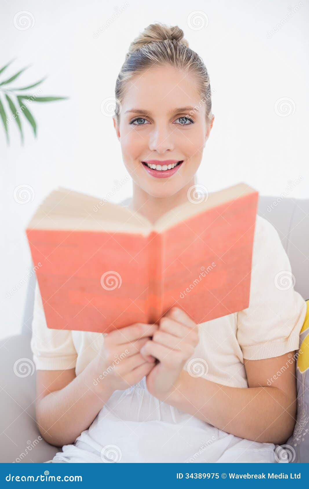 Smiling Fresh Model Reading Book Sitting on Sofa Stock Image - Image of ...