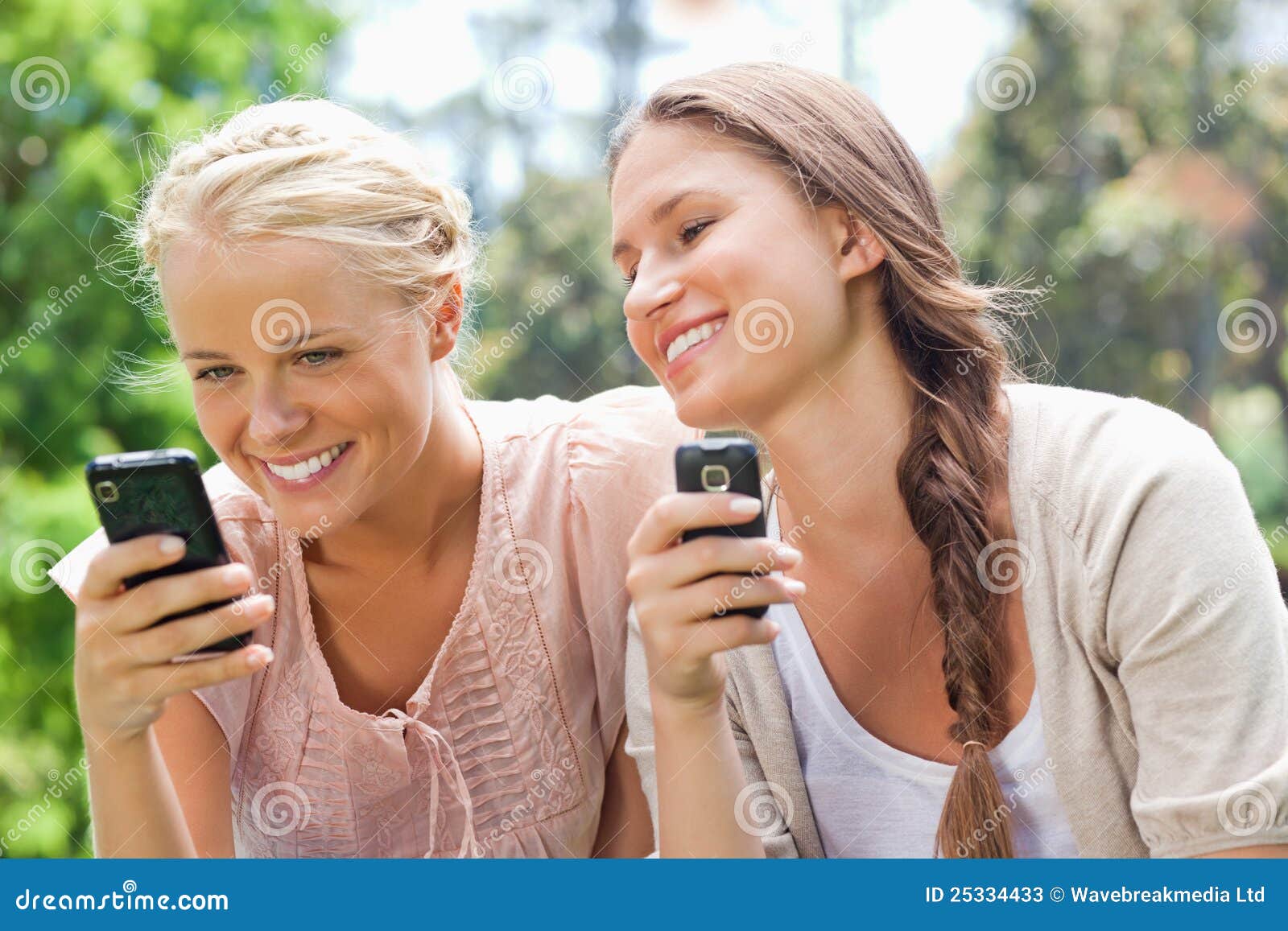 Smiling Friend with Cellphones Stock Image - Image of adult, caucasian ...