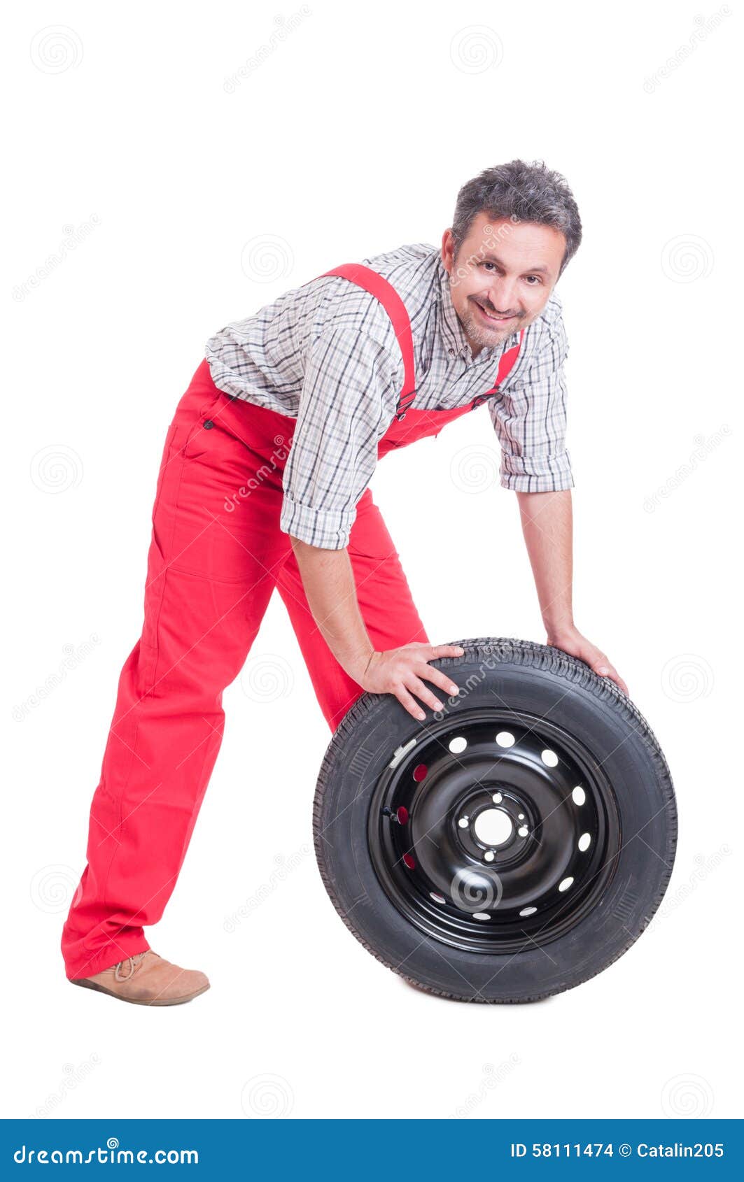 Smiling and Friendly Mechanic Pushing a New Tire Stock Photo - Image of ...