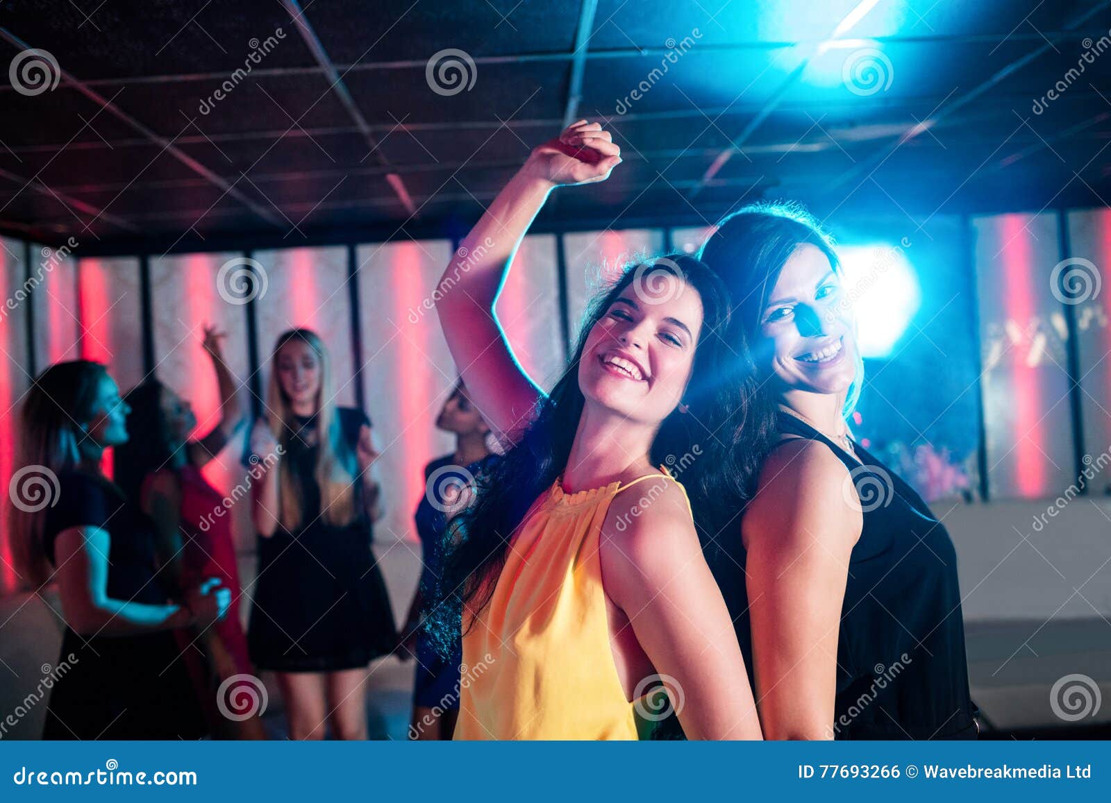 Smiling Friends Dancing on Dance Floor Stock Photo - Image of ...