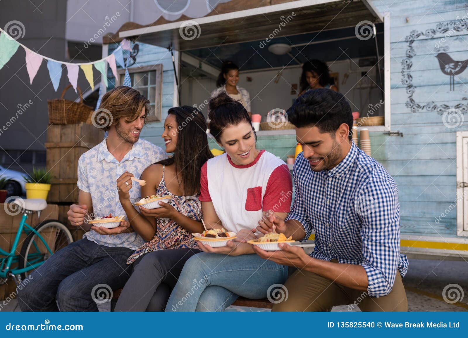 Friends Interacting while Having Snacks Stock Photo - Image of ...