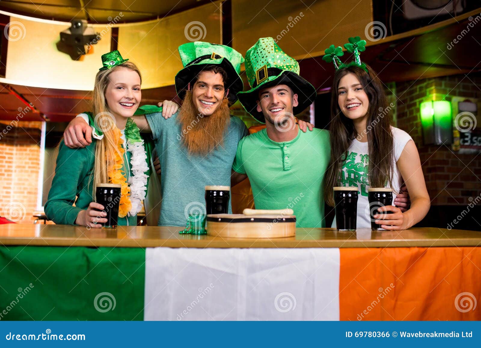 Smiling Friends with Irish Accessory Stock Photo - Image of glass, flag ...