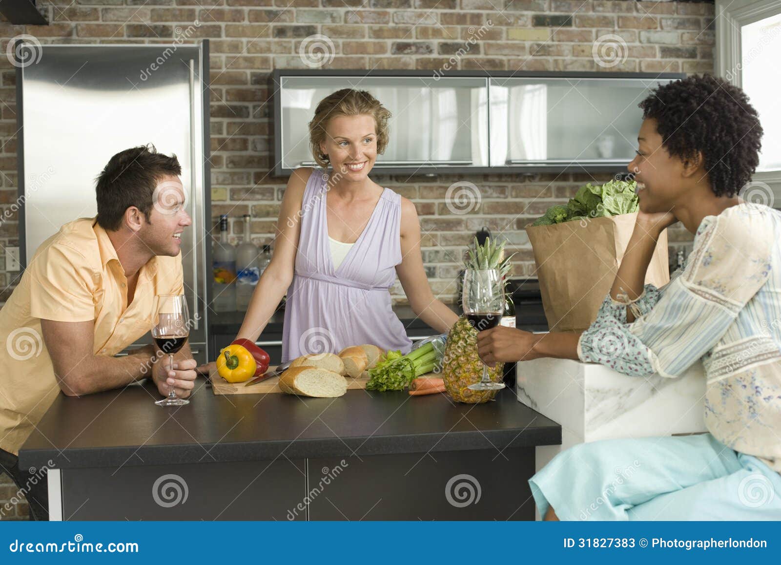 Smiling Friends at Kitchen Counter Stock Image - Image of lifestyle ...