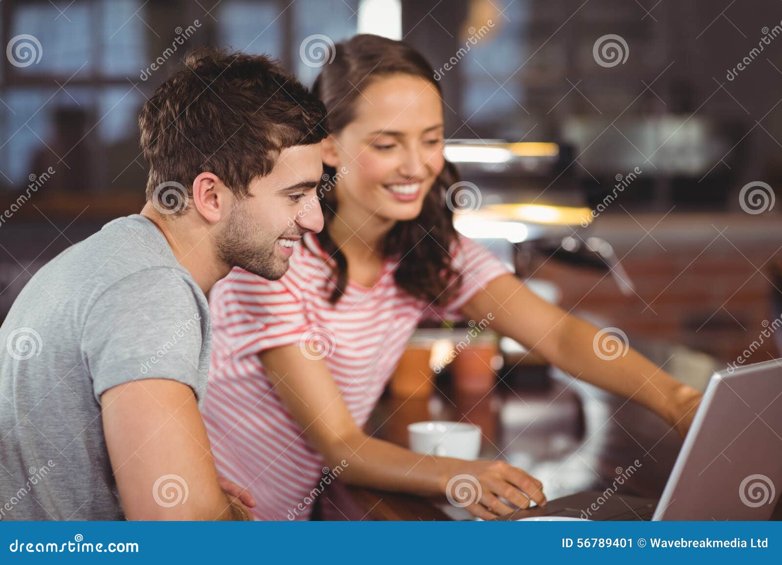 Smiling Friends Pointing and Looking at Laptop Screen Stock Image ...