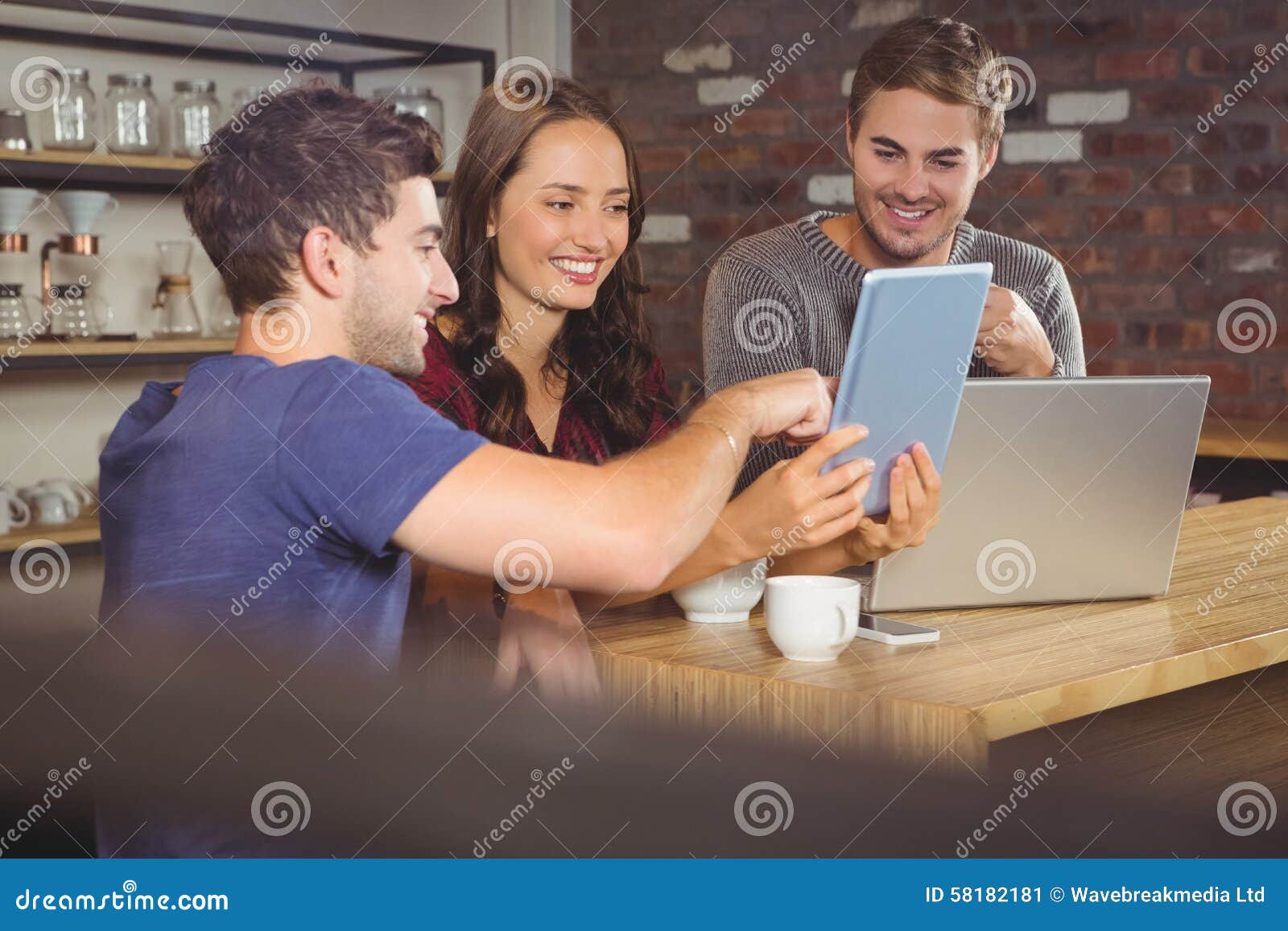 Smiling Friends Pointing and Looking at Tablet Computer Stock Image ...