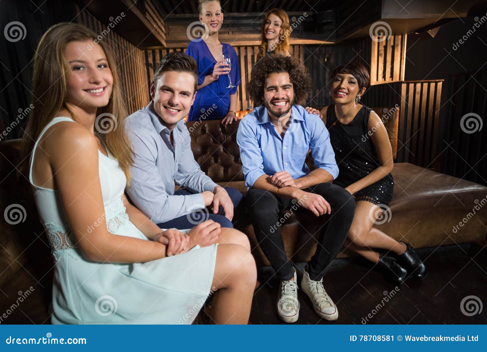 Smiling Friends Sitting Together in Sofa Stock Image - Image of indoors ...