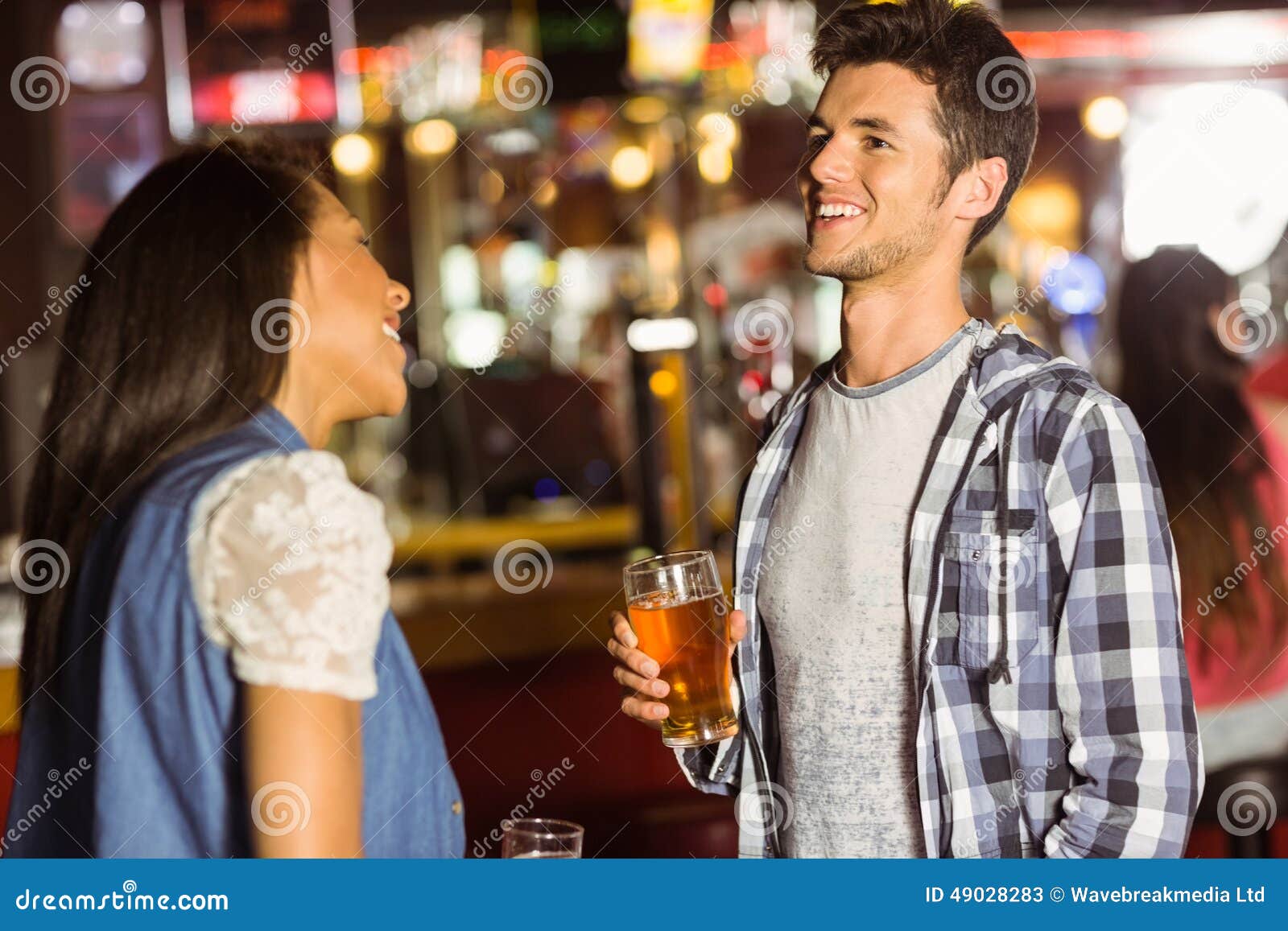 Smiling Friends Talking and Drinking Beer and Mixed Drink Stock Image ...