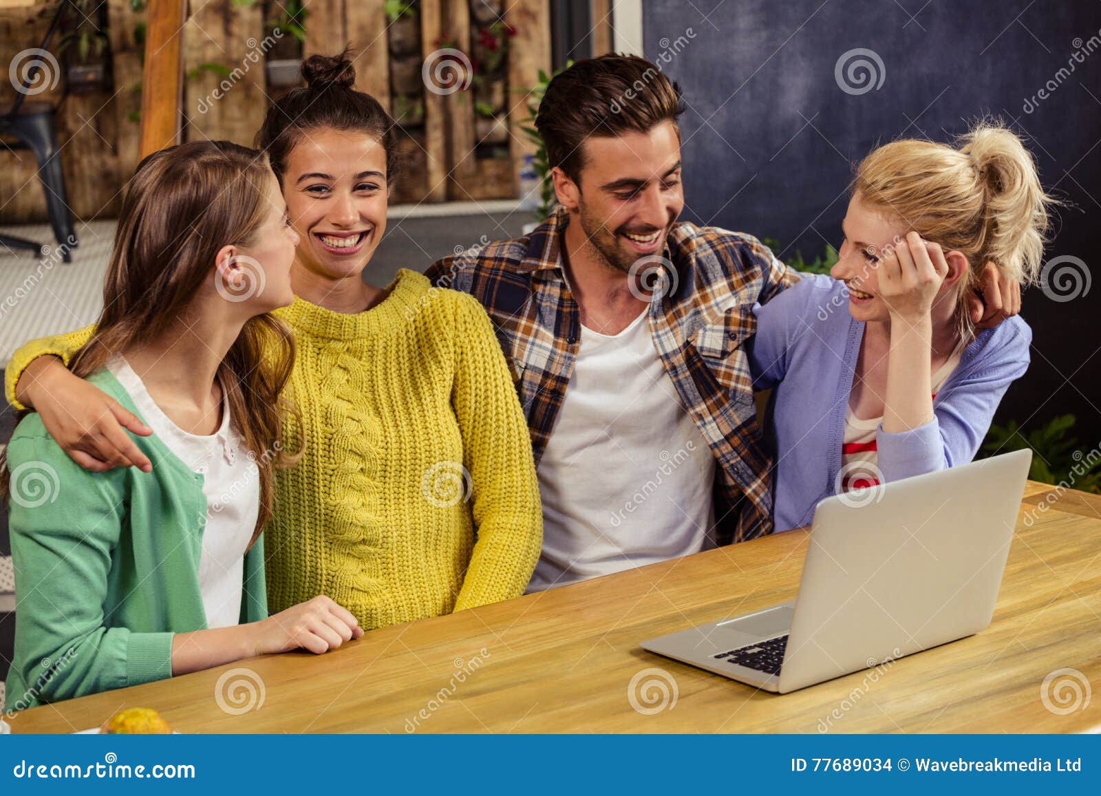Smiling Friends Using Laptop Together Stock Photo - Image of cafe ...