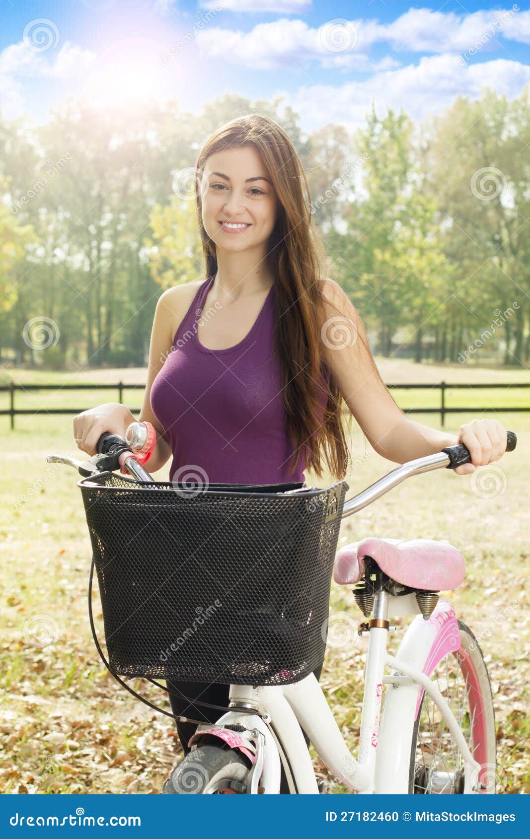 Smiling girl with bicycle stock photo. Image of carefree - 27182460