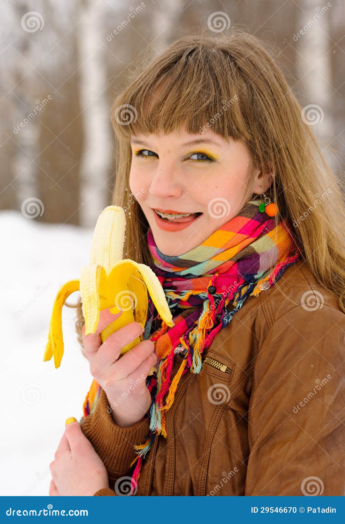 Smiling Girl Biting a Banana Stock Photo - Image of hair, fruit: 29546670