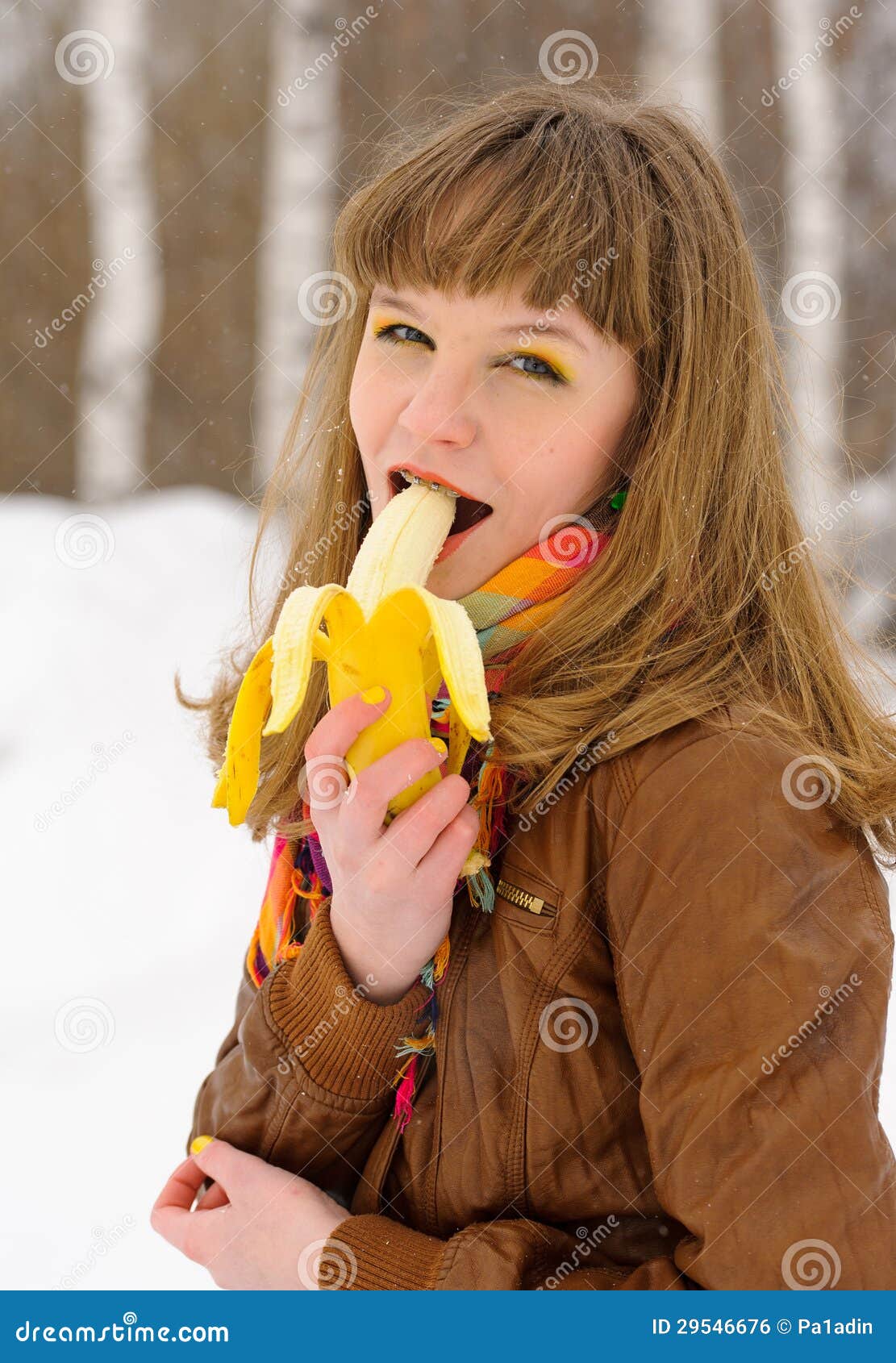 Smiling Girl Biting a Banana Stock Photo - Image of female, fashion ...