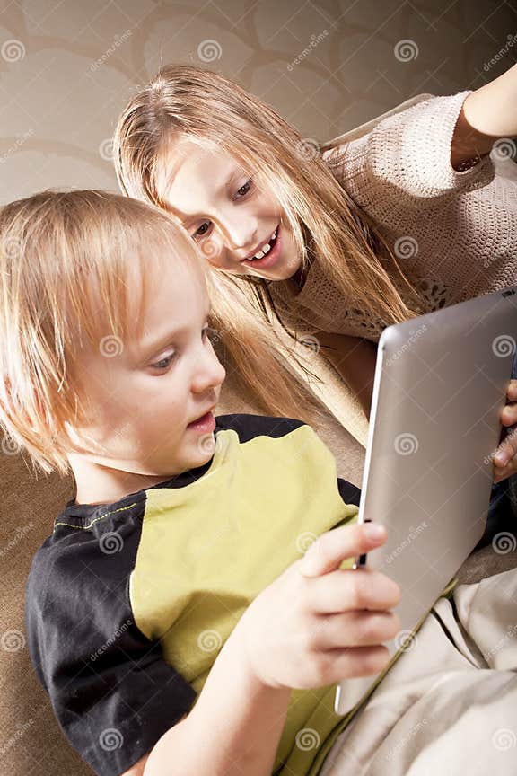Smiling Girl and Boy with Tablet Computer Stock Image - Image of ...