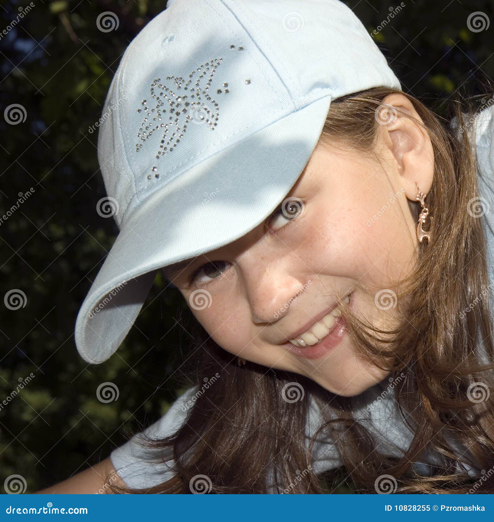 The smiling girl in a cap stock image. Image of head - 10828255