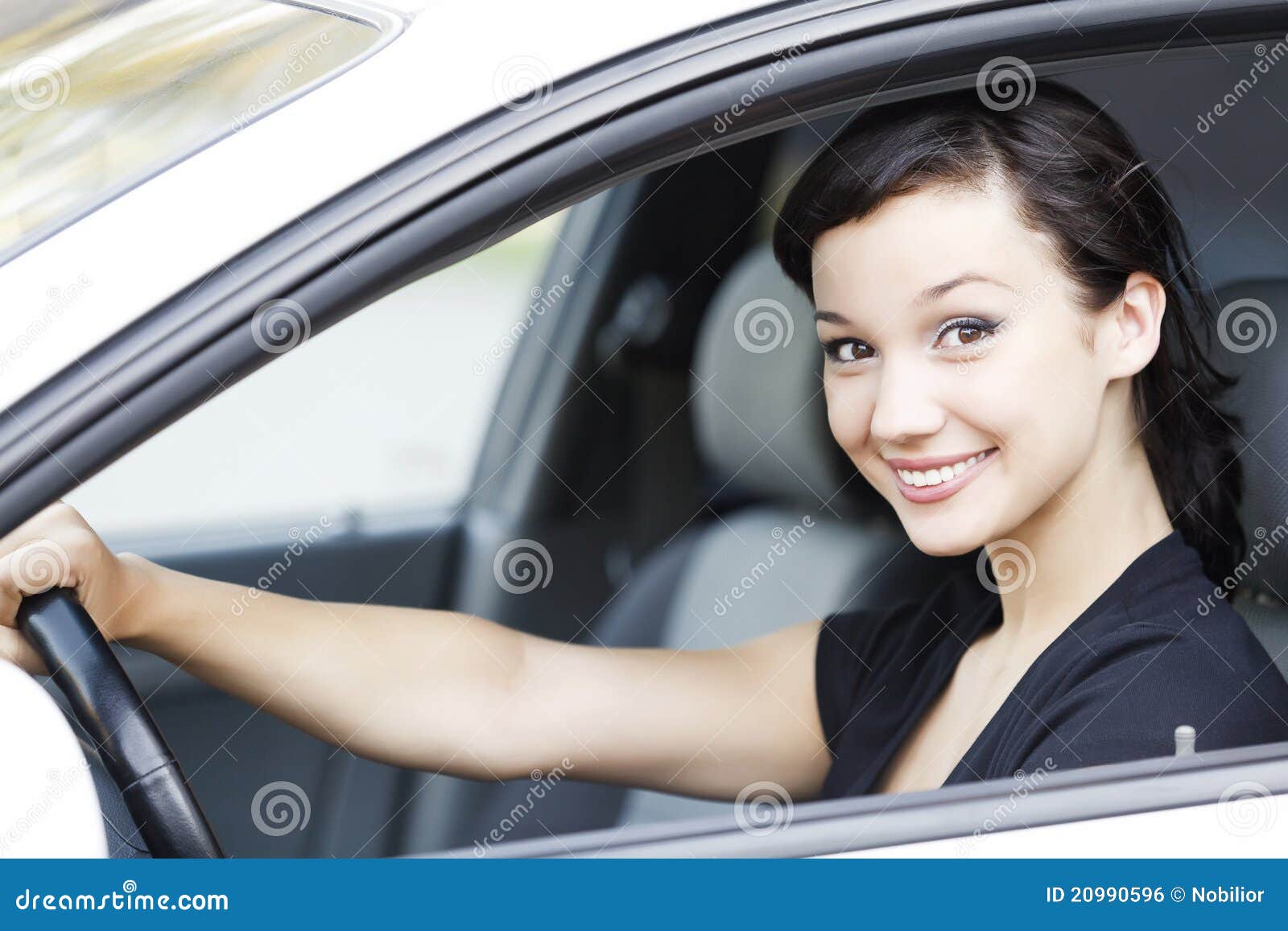 Smiling girl in a car stock photo. Image of customer - 20990596