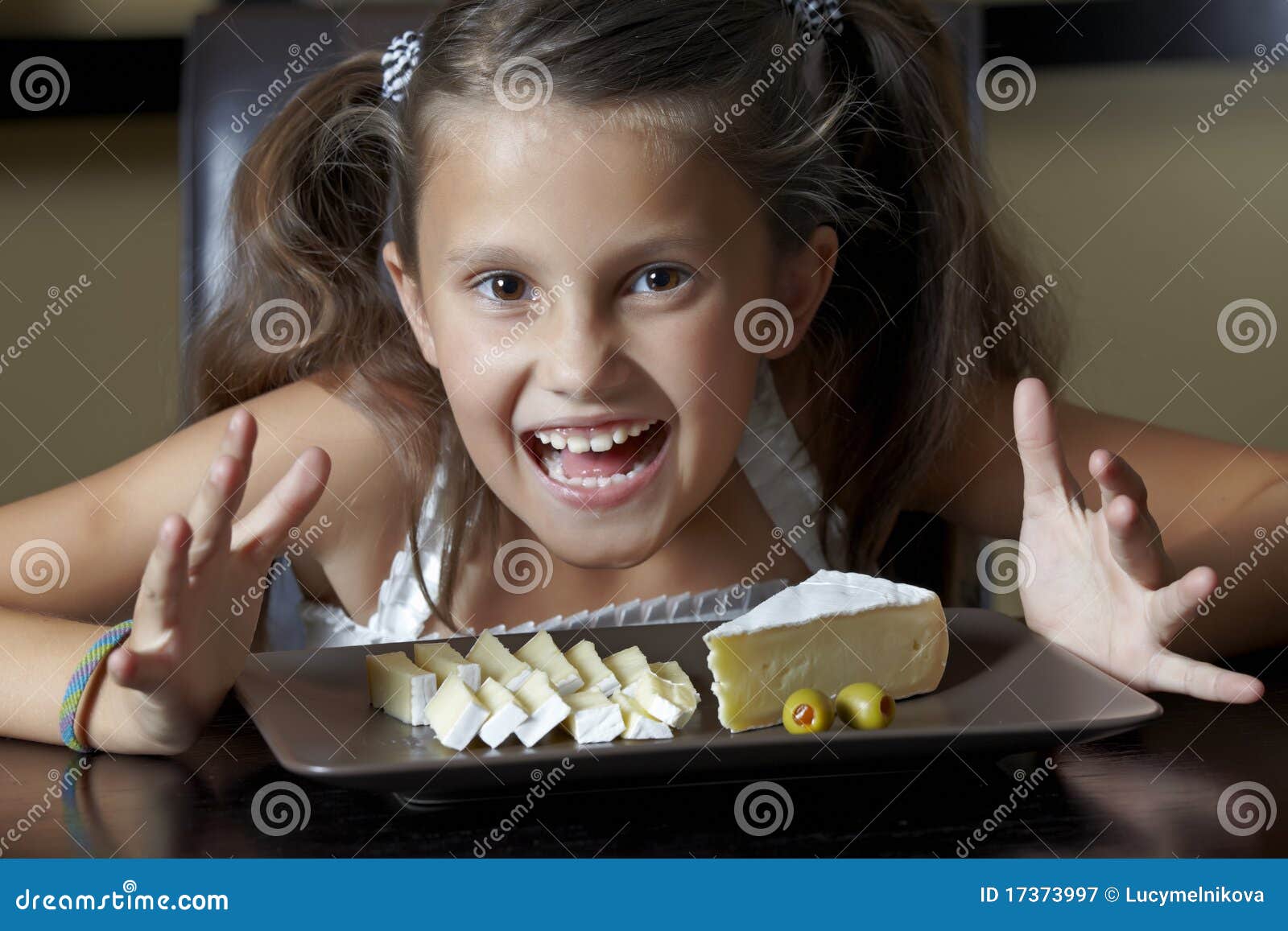 Smiling girl with cheese stock image. Image of lunch - 17373997