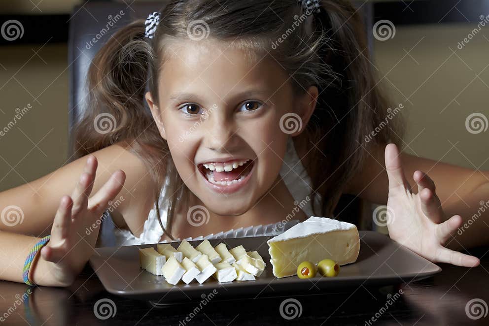 Smiling girl with cheese stock image. Image of lunch - 17373997