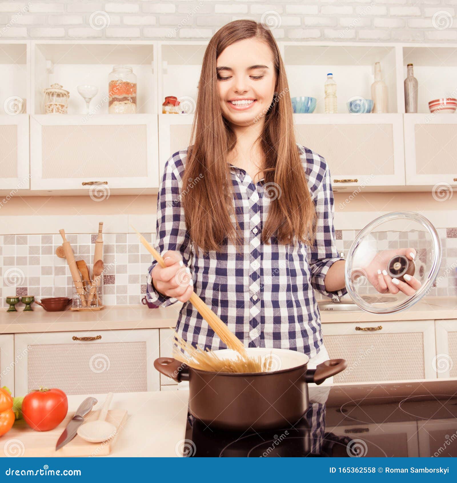 Smiling Girl Cooking Pasta in the Kitchen Stock Photo - Image of ...