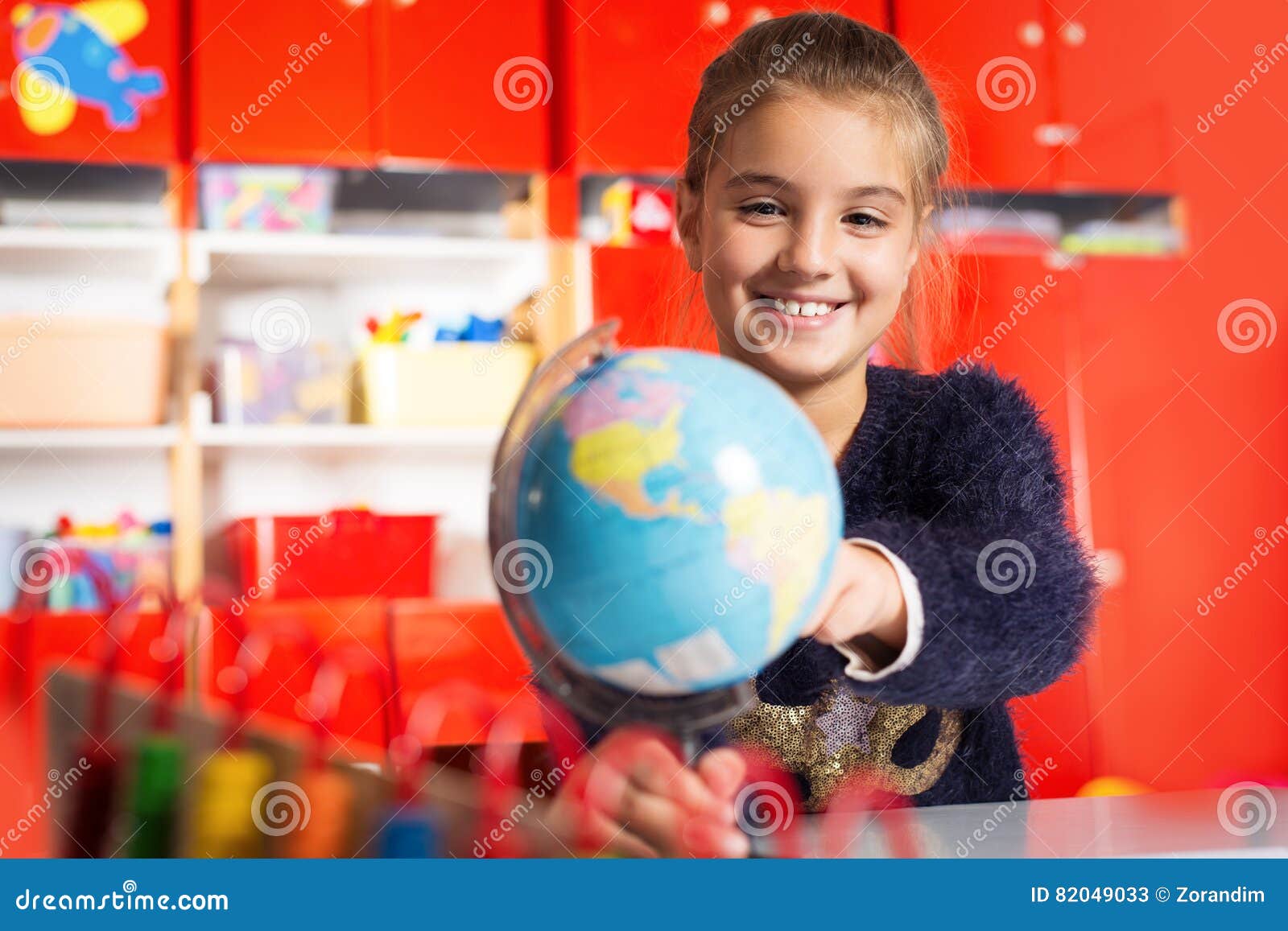 Smiling Girl Exploring Globe Stock Image - Image of school, casual ...