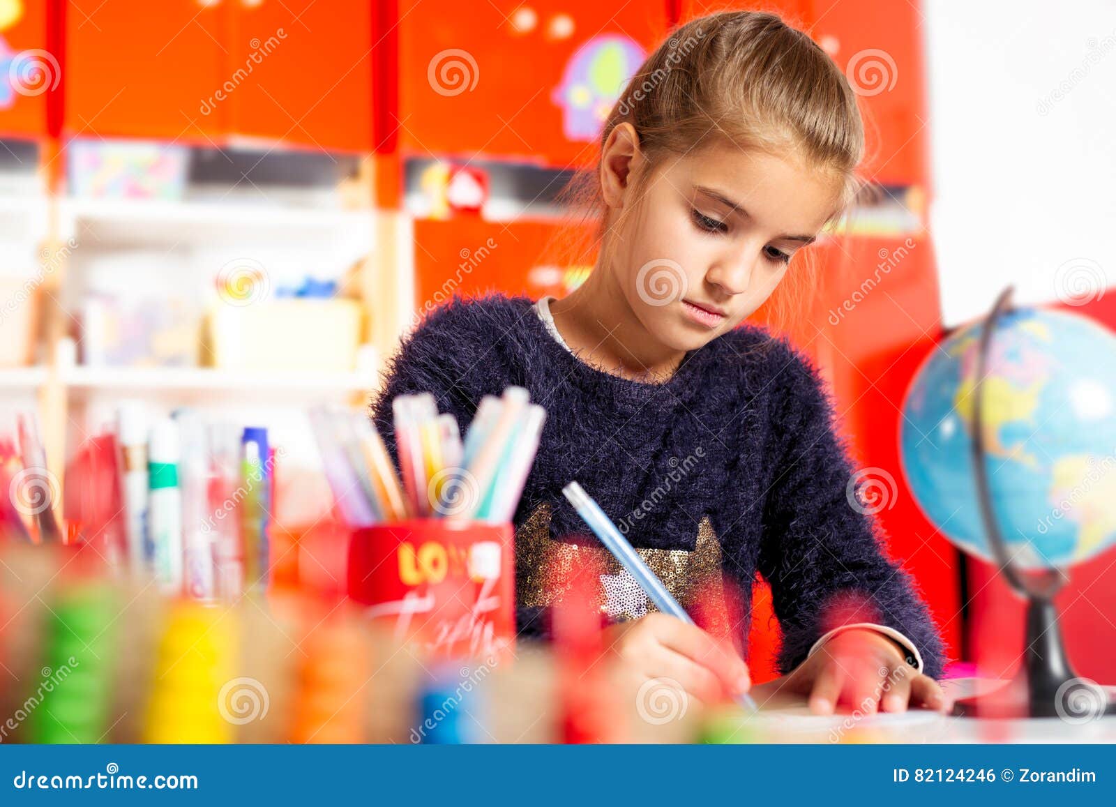 Smiling Girl Exploring Globe Stock Photo - Image of young, people: 82124246