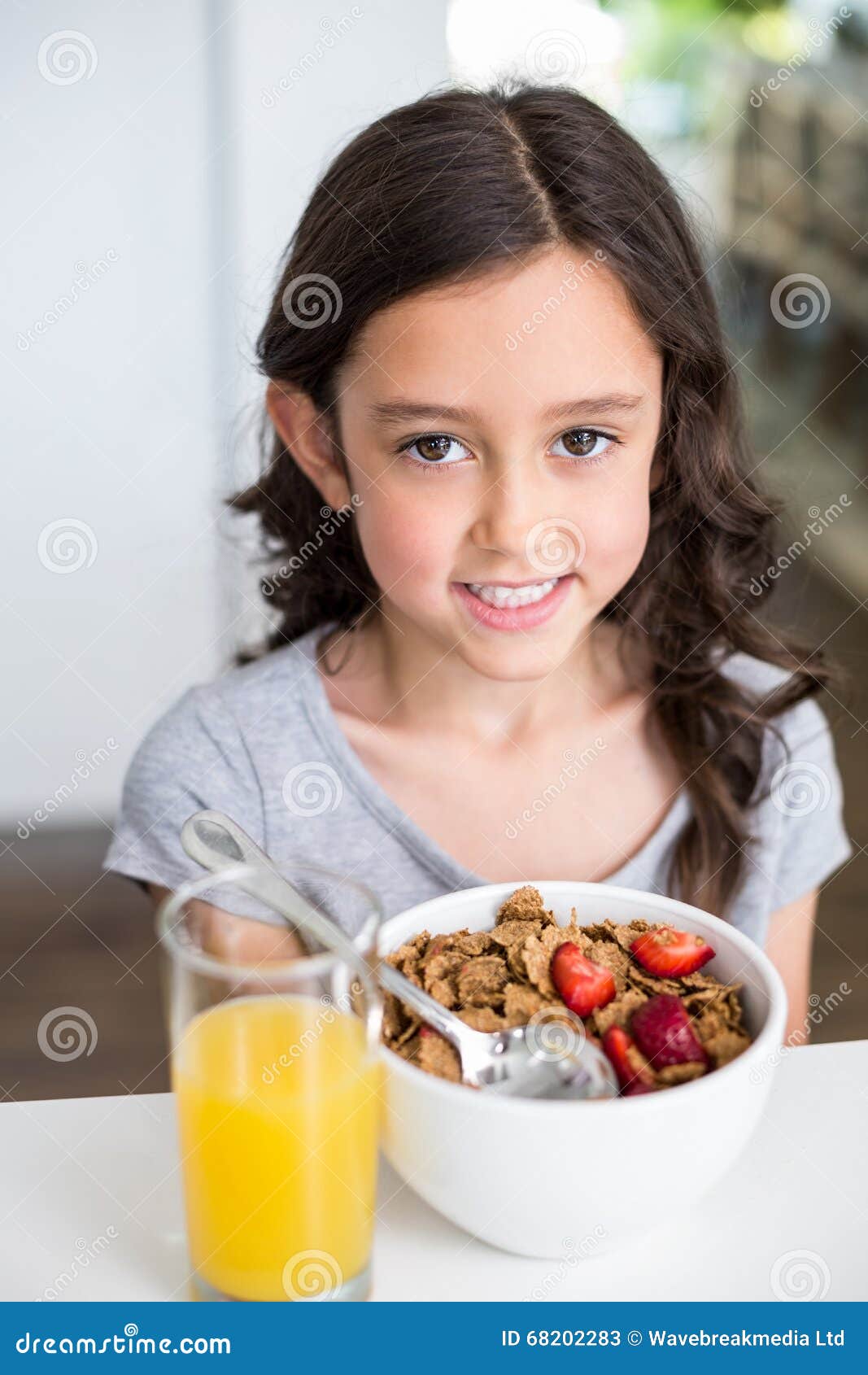 Smiling Girl Having Breakfast Stock Image - Image of foreground ...
