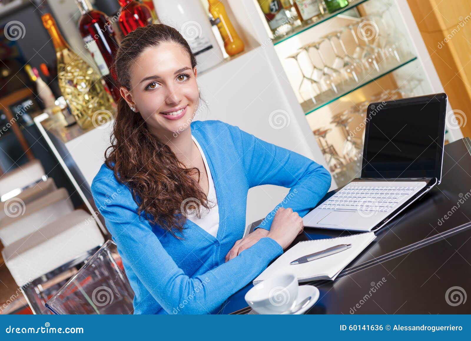 Smiling Girl Having a Coffee Break and Working on a Computer Stock ...