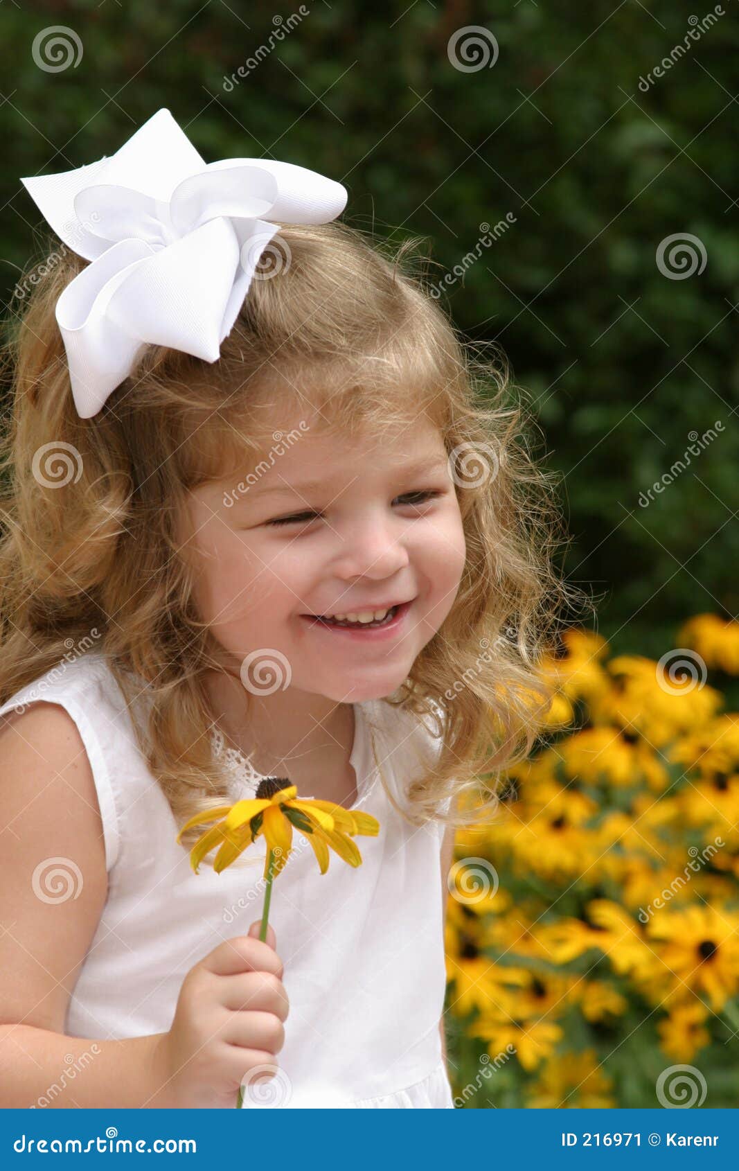 Smiling Girl Holding Flower Stock Image - Image of summer, child: 216971
