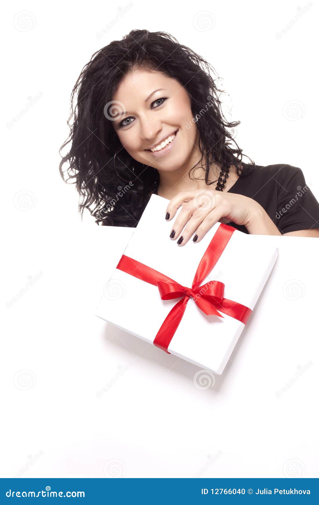 Smiling girl holds a gift stock photo. Image of expression - 12766040
