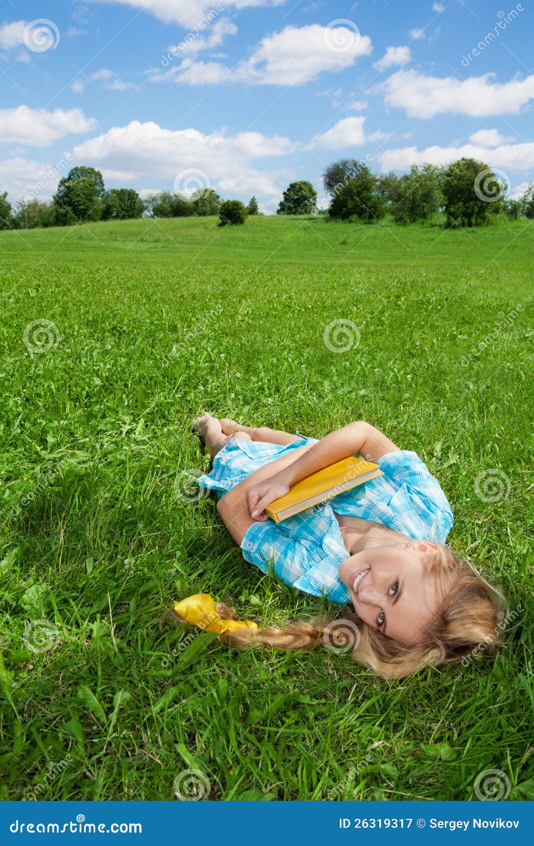 Smiling Girl Laying on Lawn Stock Image - Image of hair, countryside ...