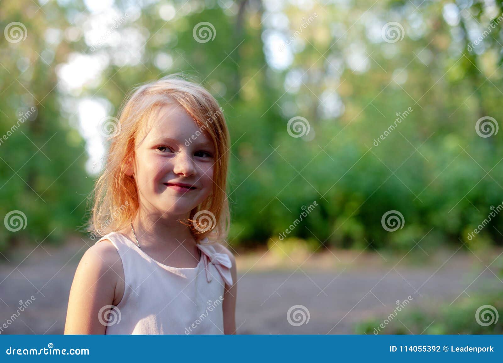 Smiling Girl Lit by the Sun Stock Photo - Image of european, sweet ...