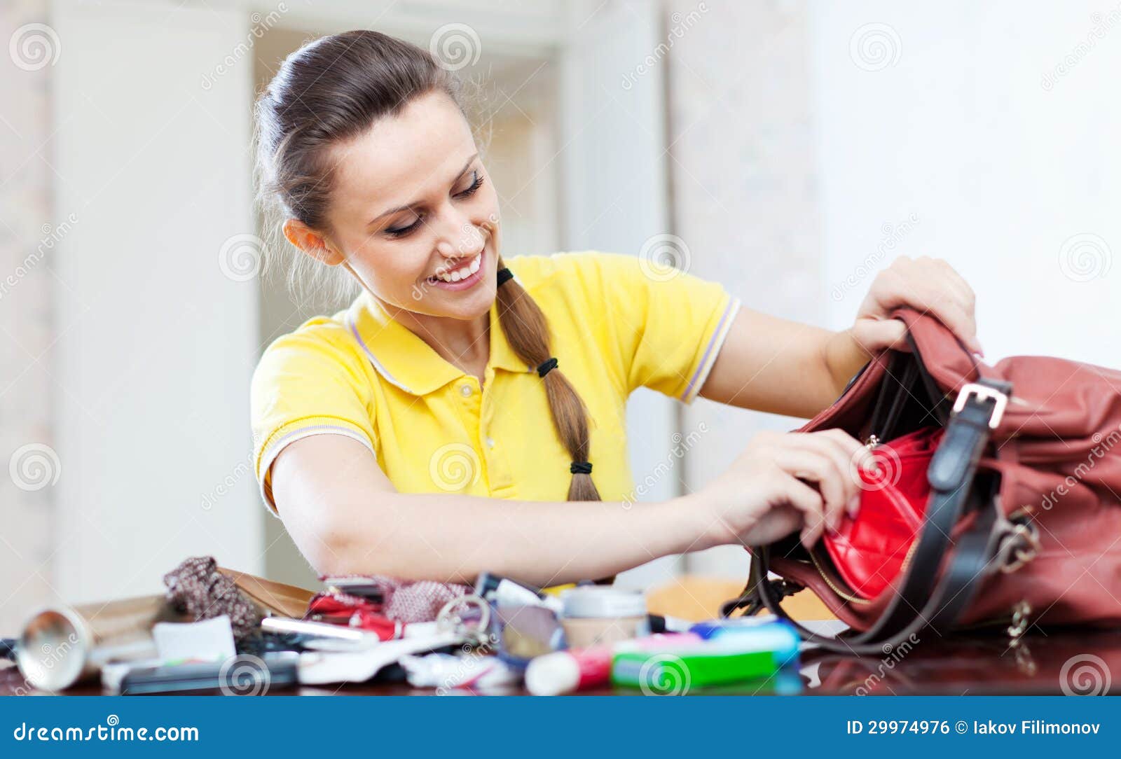 Smiling Girl Looking for Something in Handbag Stock Photo - Image of ...
