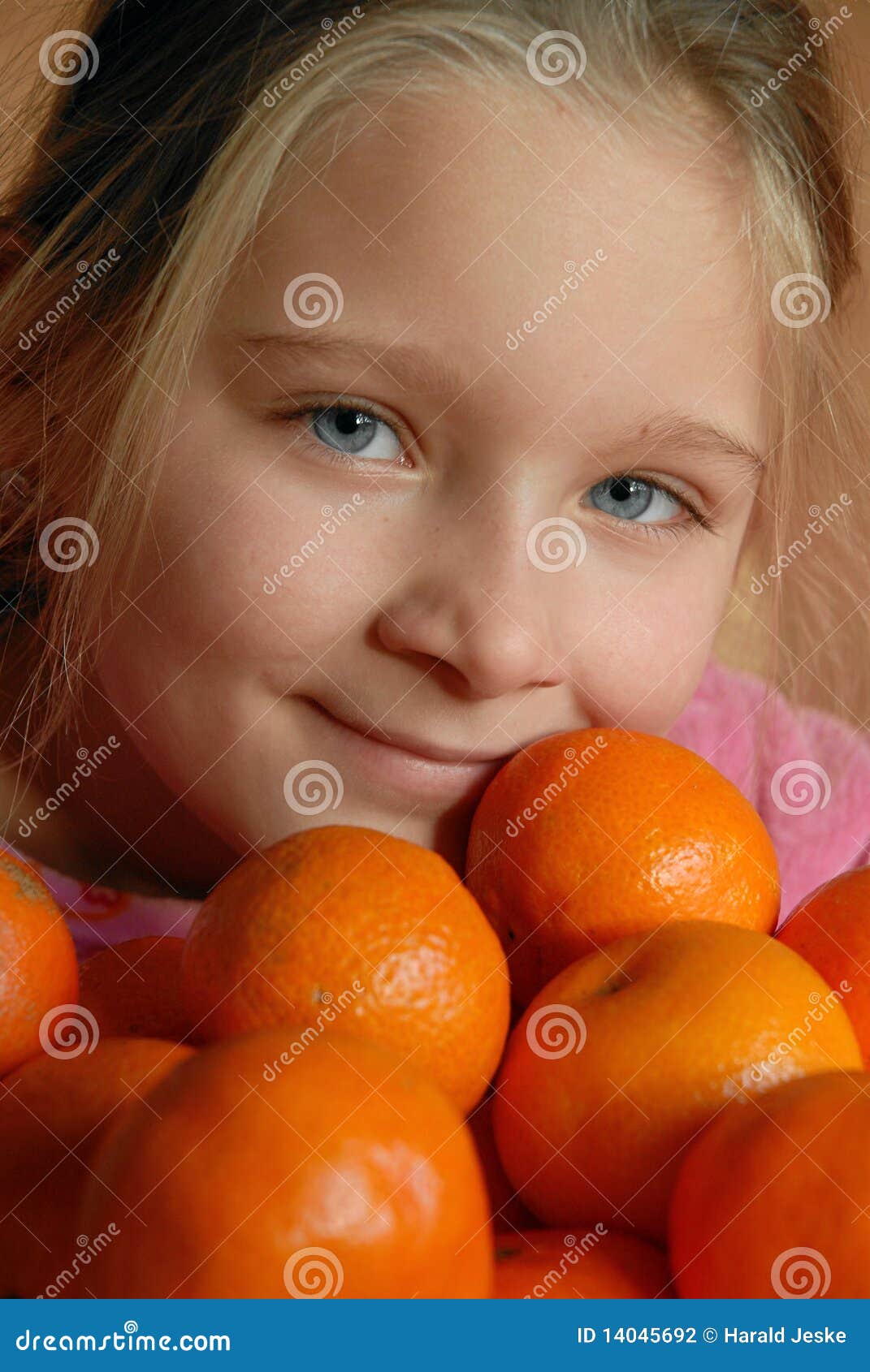 Smiling girl with oranges stock photo. Image of ripe - 14045692