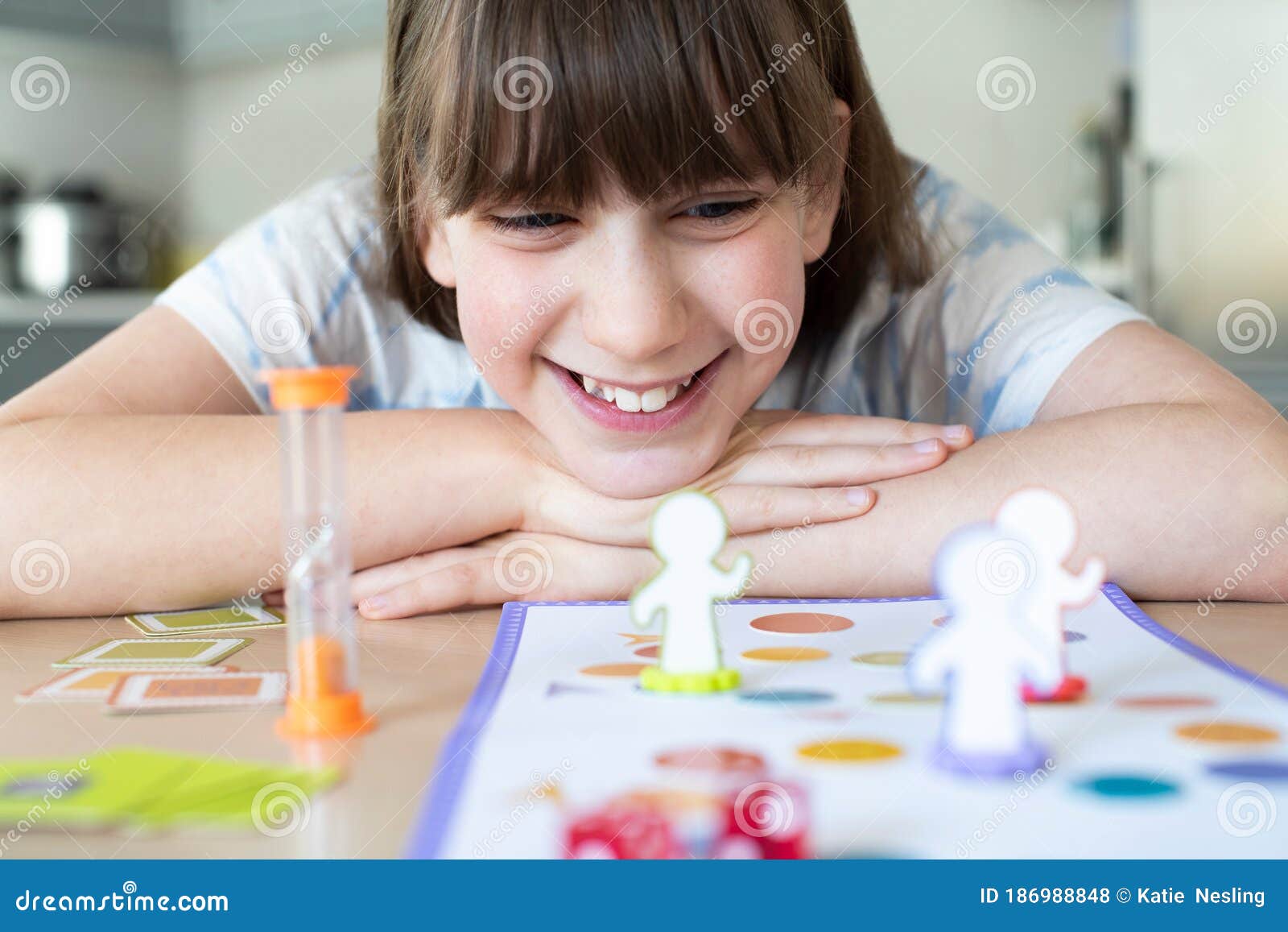 Smiling Girl Playing Generic Board Game at Home Stock Photo - Image of ...