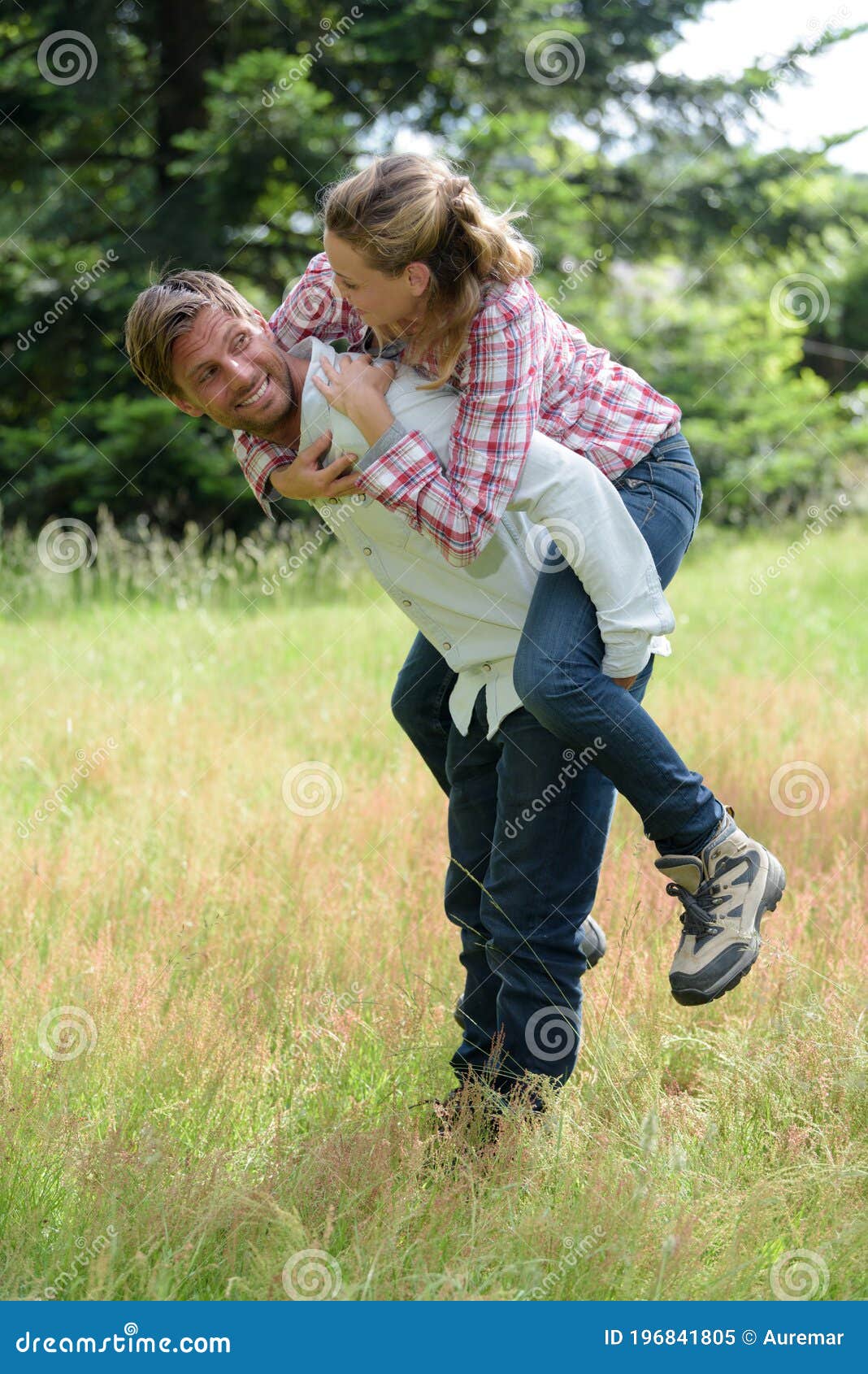 Smiling Girl Rides on Back Guy Outdoors Stock Image - Image of friend ...