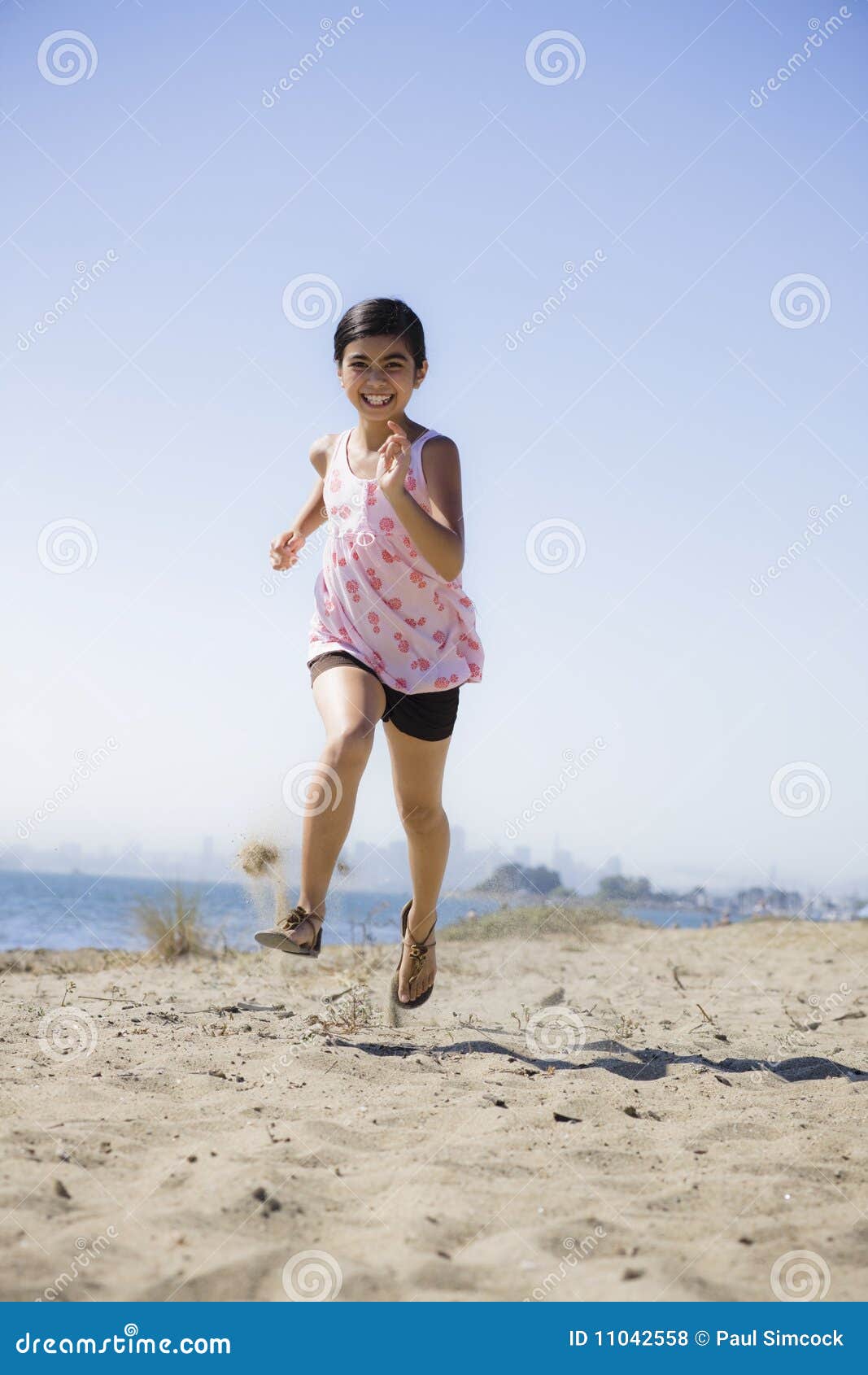 Smiling Girl Running on Beach Stock Photo - Image of asian, outdoors ...