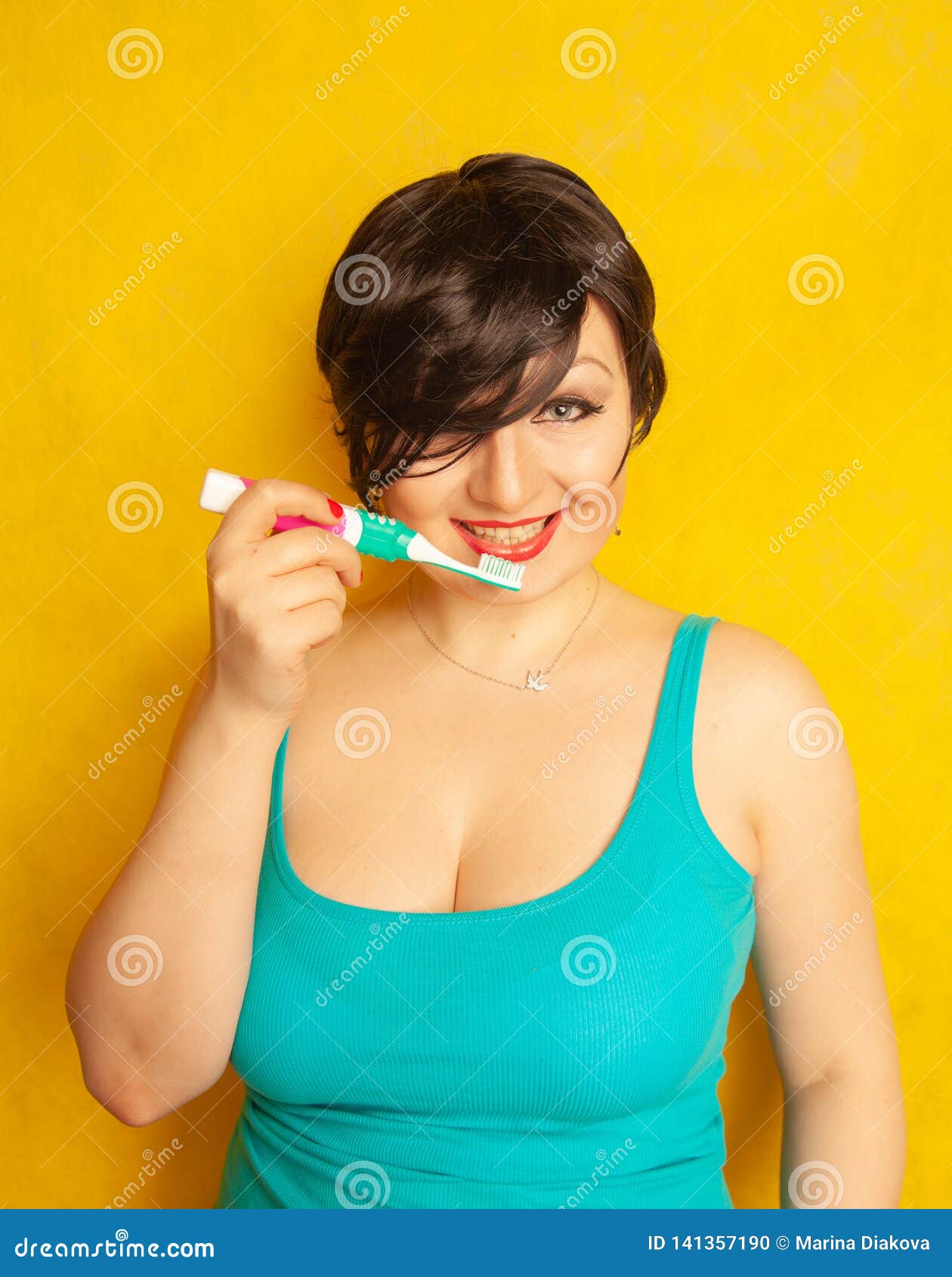 Smiling Girl With Short Hair And A Curvy Figure Stands With A