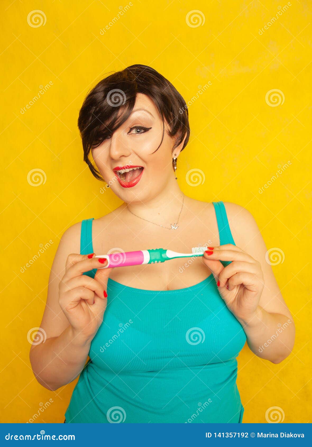 Smiling Girl With Short Hair And A Curvy Figure Stands With A