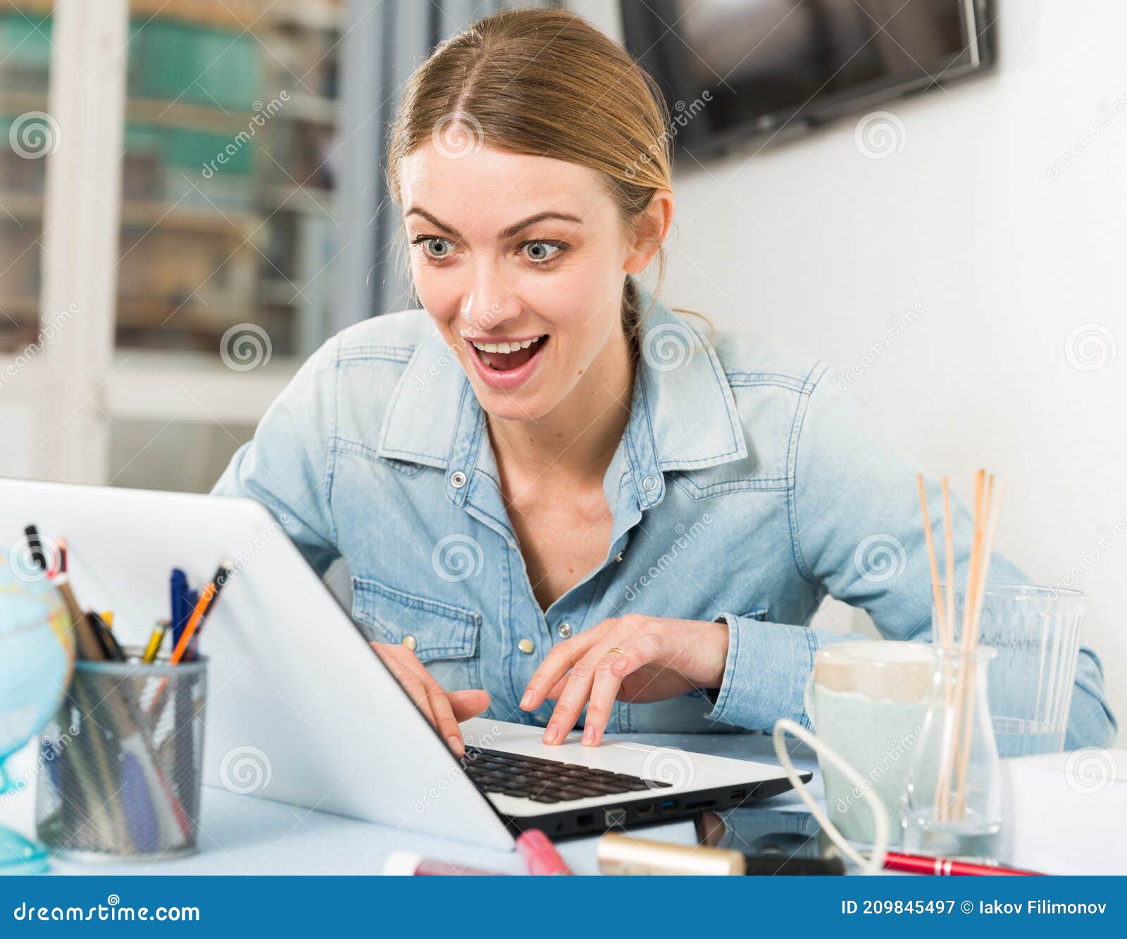 Smiling Girl Sitting at Table at Home Calculating Domestic Finances and ... Smiling Girl Sitting at Table at Home Calculating Domestic Finances and ...