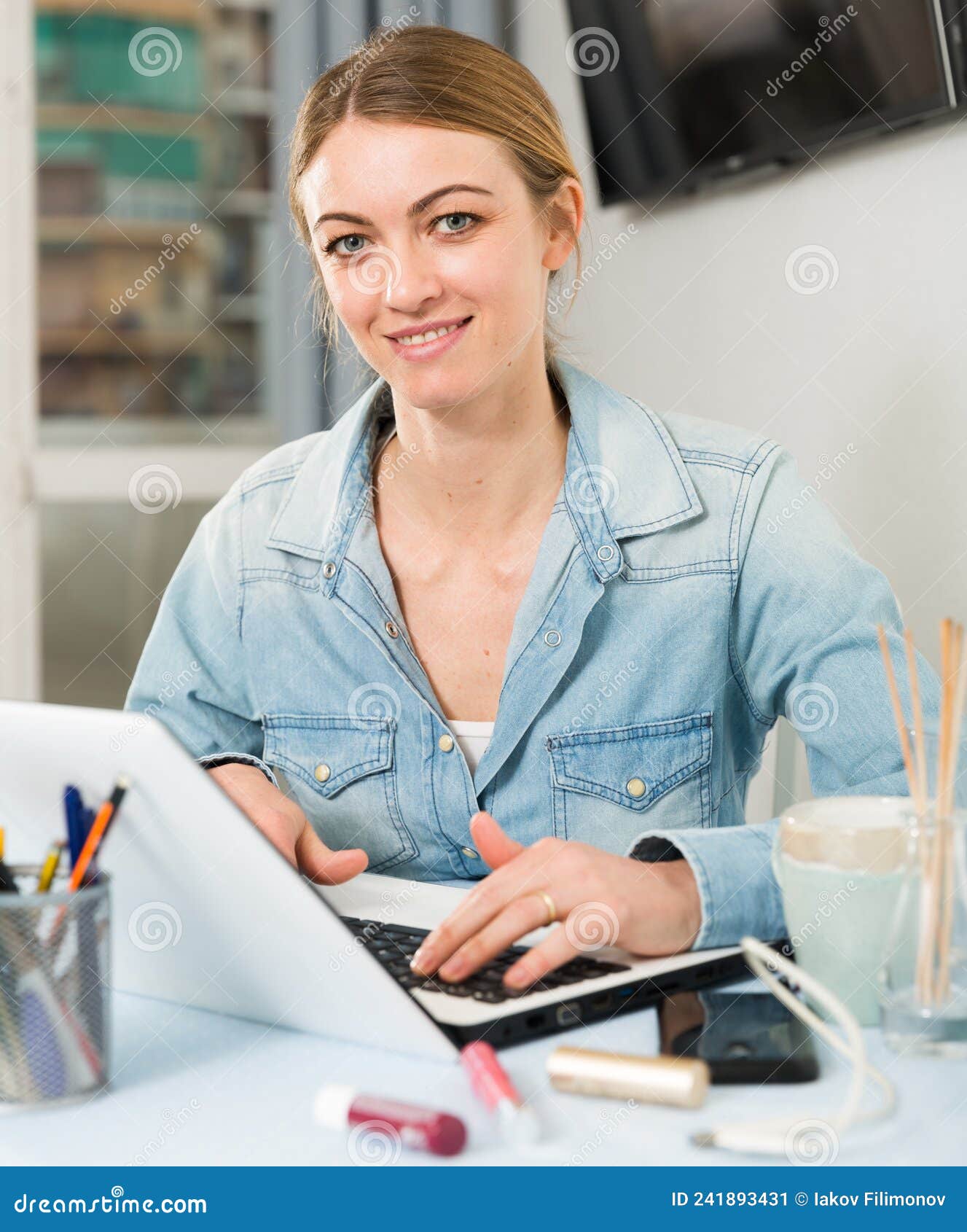 Smiling Girl Sitting at Table at Home Calculating Domestic Finances and ... Smiling Girl Sitting at Table at Home Calculating Domestic Finances and ...