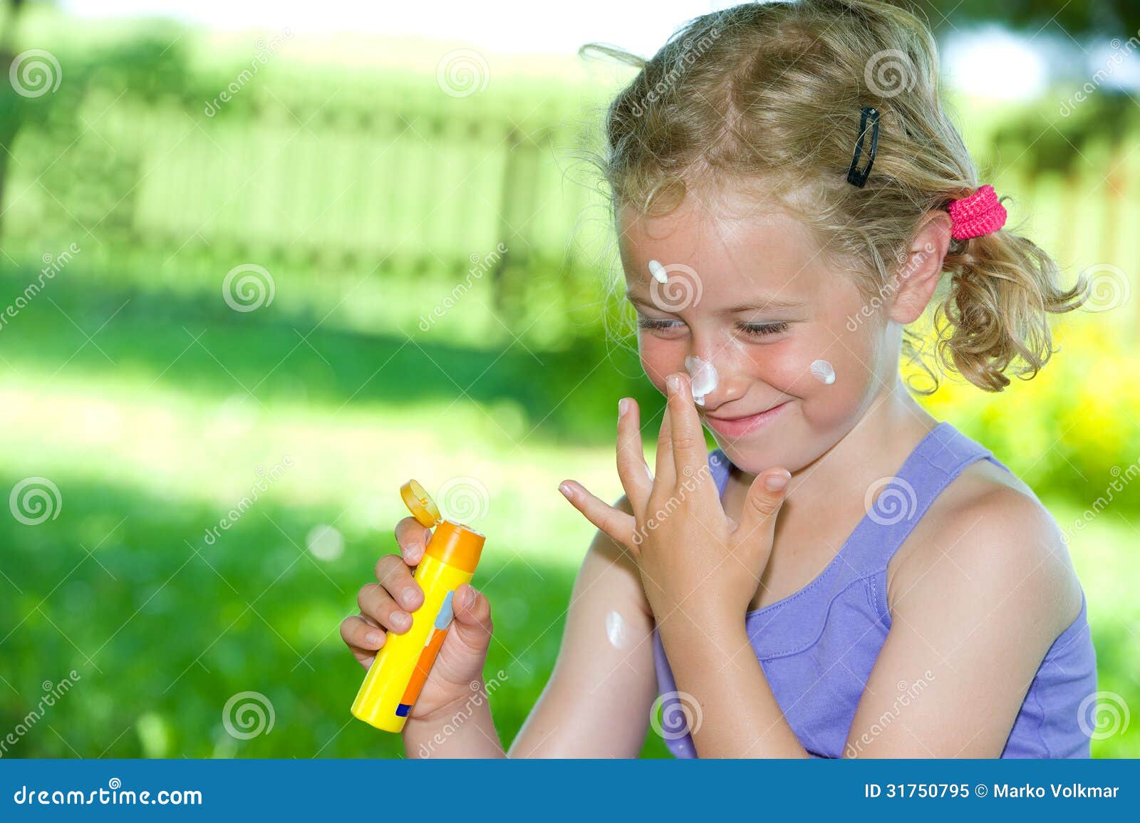 Smiling girl with suncream stock image. Image of pretty - 31750795